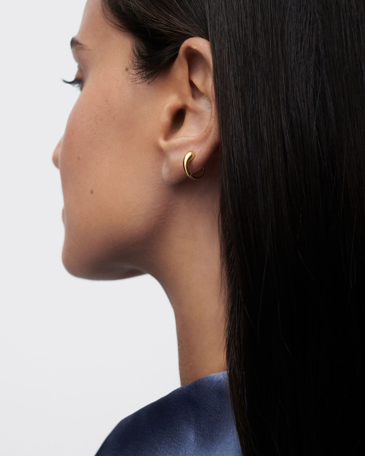 Mini single huggie hoop featuring sculptural drop-shaped motif and ...