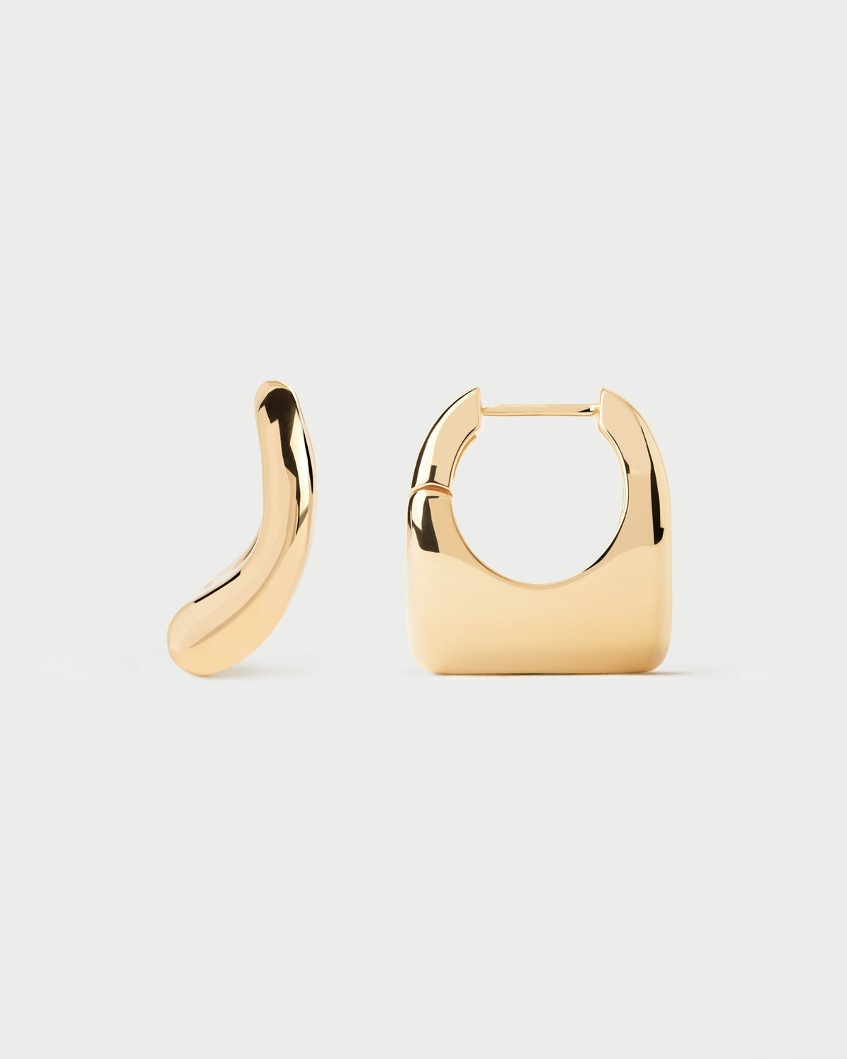 Gold-plated medium geometric hoop earrings with a wavy bean shape ...